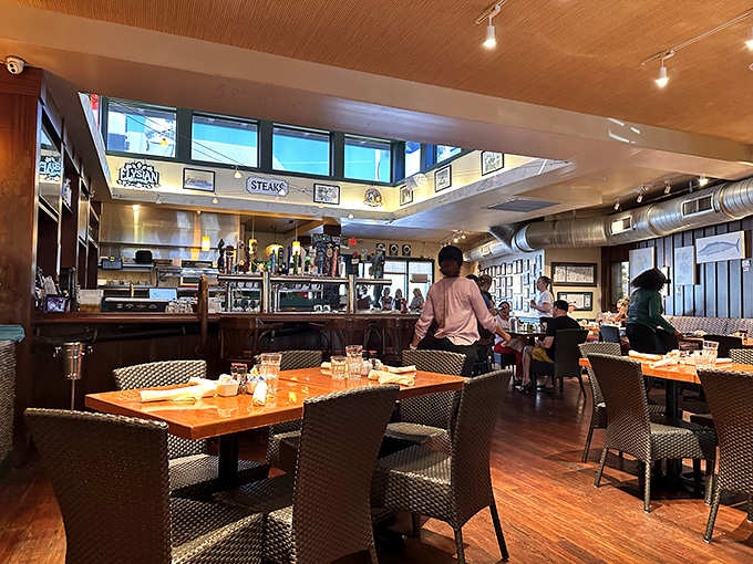 The warm, inviting interior features exposed ductwork and clerestory windows that bathe the space in that magical Florida Keys light.