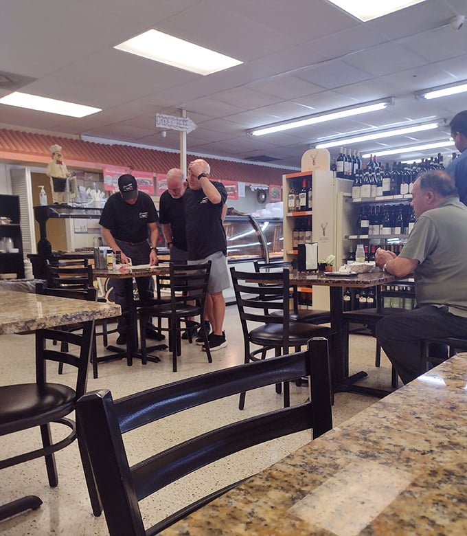 The seating area serves as Tampa's little Italy town square &ndash; where regulars gather to break bread and share stories.