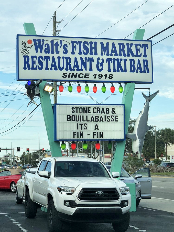 Walt's sign promises seafood salvation since 1918. That shark silhouette isn't decoration &ndash; it's a warning to inferior seafood establishments.
