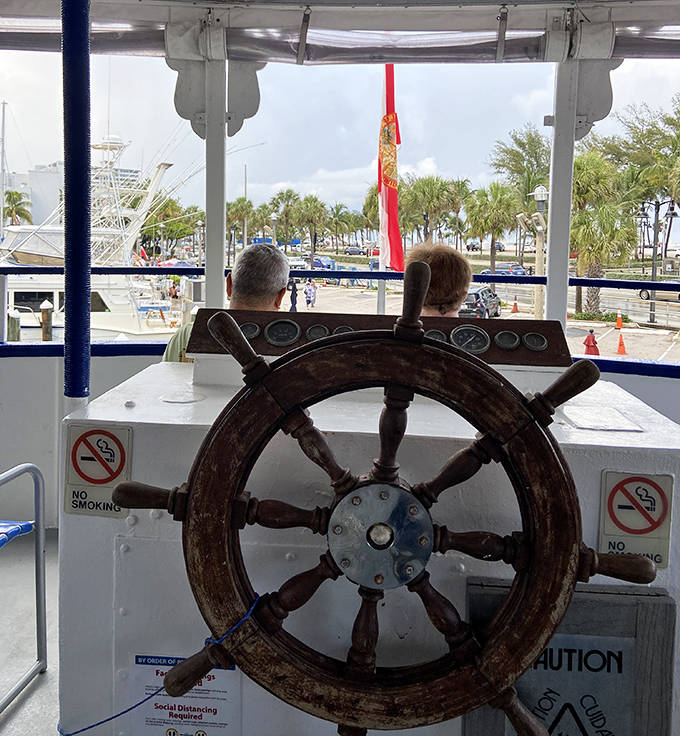 The captain's wheel stands ready, worn smooth by generations of hands guiding this grand lady through the "Venice of America" since the 1930s.