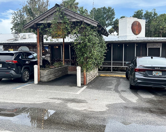 The Yearling Restaurant's rustic exterior welcomes diners seeking authentic Florida cracker cuisine in the wilderness that inspired Marjorie Kinnan Rawlings.