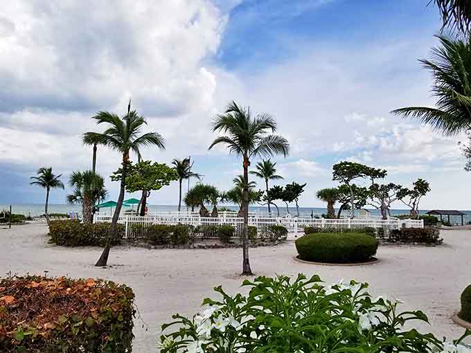 Swaying palms and manicured grounds create a peaceful setting at Island Inn, where Old Florida charm meets beachfront bliss.