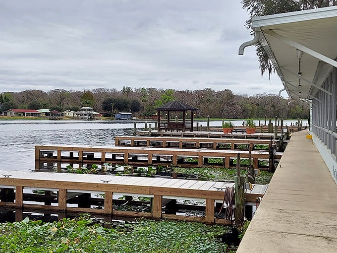 The wooden pier at Lake George extends into waters that catch fire with color during the golden hour, creating postcard-perfect moments daily.