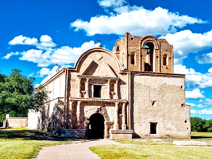 The mission's bell tower reaches toward a perfect blue sky. Tumac&aacute;cori National Historical Park preserves an important piece of Arizona's multicultural heritage.