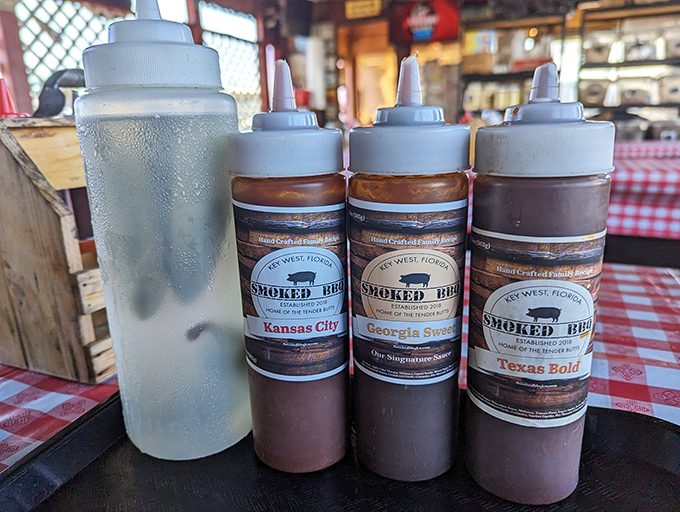 The holy trinity of barbecue sauces&mdash;Georgia Sweet, Kansas City, and Texas Bold&mdash;ready to anoint your meat with liquid glory.