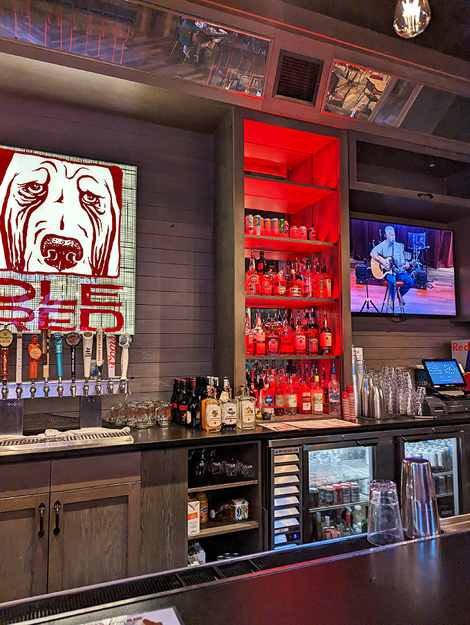 The bar's red-lit shelves showcase an impressive spirits collection &ndash; liquid inspiration for the music that flows throughout the venue.