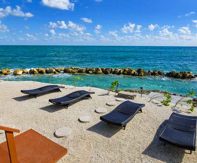 These lounge chairs positioned by the water are basically horizontal meditation pods, perfect for achieving enlightenment or at least a really good tan.