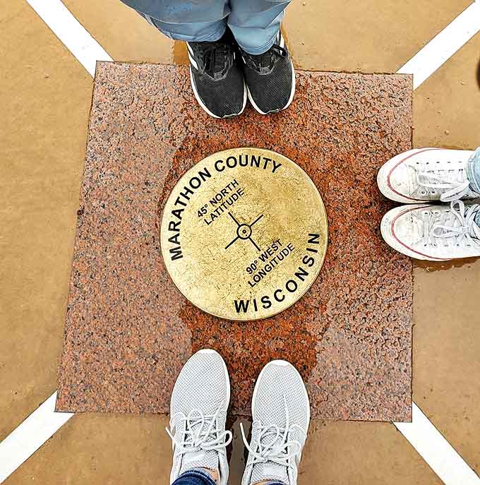 The marker's precise design reflects the mathematical exactitude of its location, a physical manifestation of cartographical concepts.