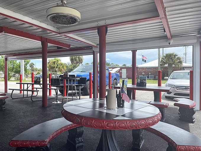 The outdoor patio offers front-row seats to Melbourne life, where red tables invite you to linger long after your last fry disappears.