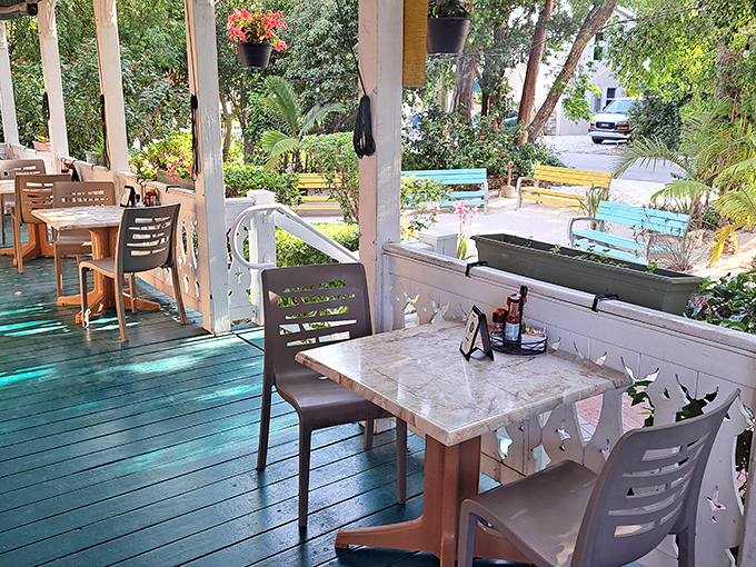 The wraparound porch offers front-row seats to paradise &ndash; where tables await morning conversations and the gentle percussion of silverware on plates.