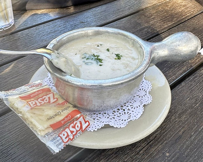 The famous She Crab soup arrives in its silver serving cup &ndash; a velvety, rich creation that showcases the sweet delicacy of crab in every spoonful.