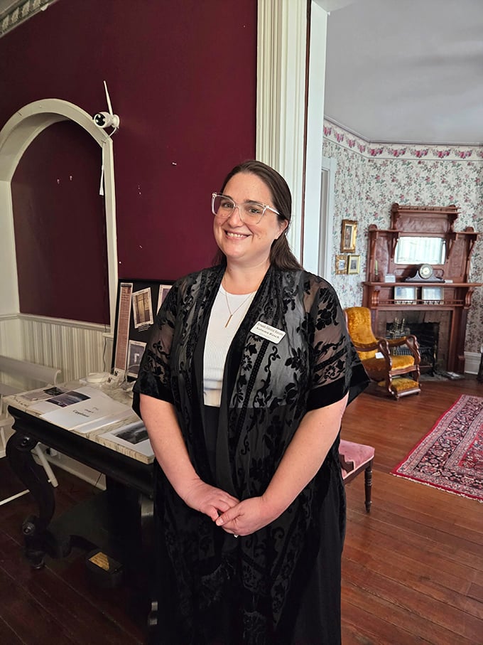 A knowledgeable guide welcomes visitors, ready to share both historical facts and the unexplained phenomena reported within these walls.