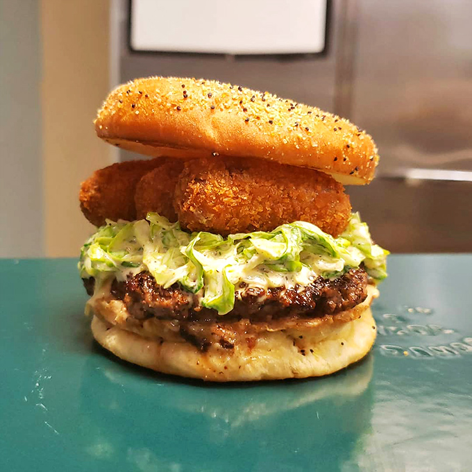 The See You Later Alligator burger with its vibrant pink pickled onions proves that this kitchen's creativity knows no bounds.