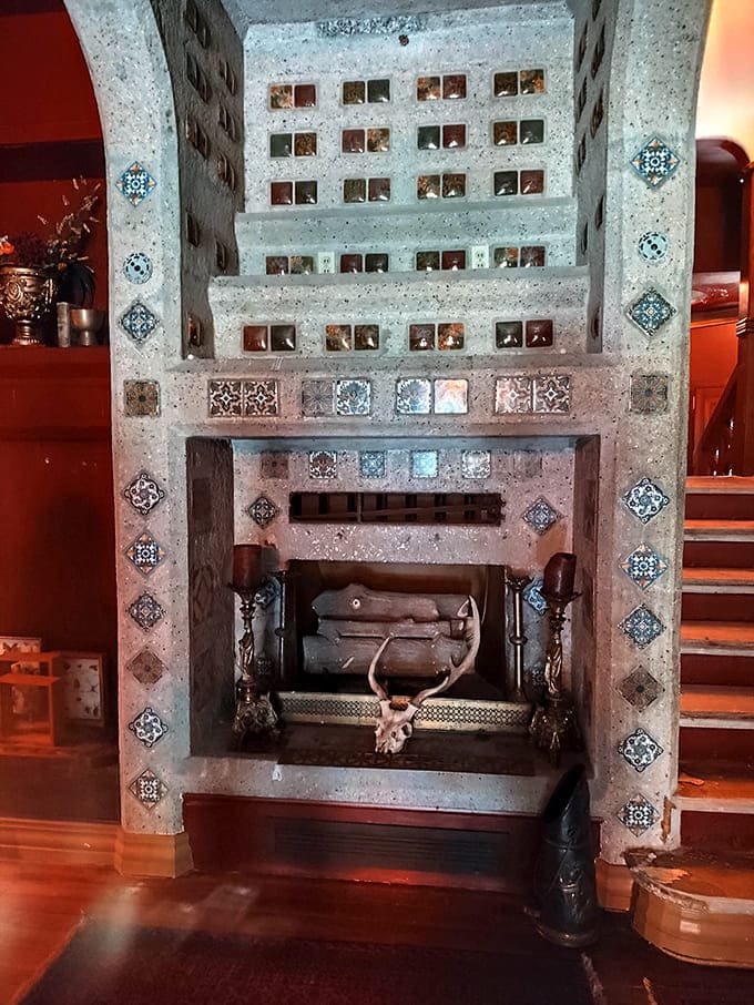 This fireplace doesn't just heat a room, it commands attention with tiles and stones arranged in patterns that hypnotize anyone who stares too long.