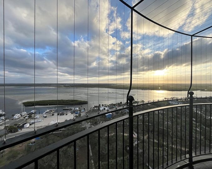 The view from the lighthouse gallery deck rewards climbers with a breathtaking panorama of coastline, inlet, and endless Atlantic horizon.