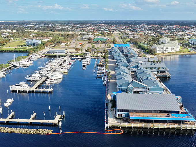 The village stretches along the waterfront like a blue-hued beacon of leisure, where shopping and boating exist in perfect harmony.