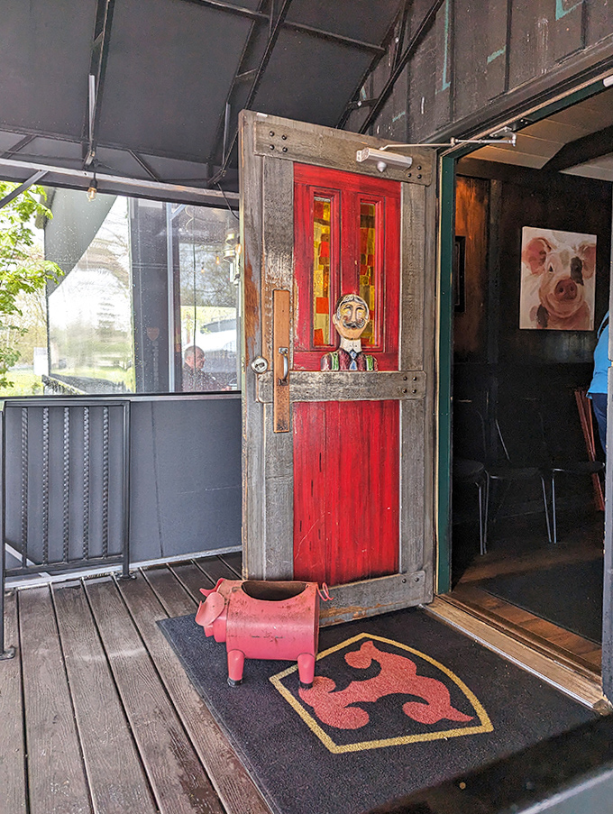 Entrance Door: That quirky red door with its carved face doesn't just mark an entrance&mdash;it's a portal to a world where food is honest and memories are made.