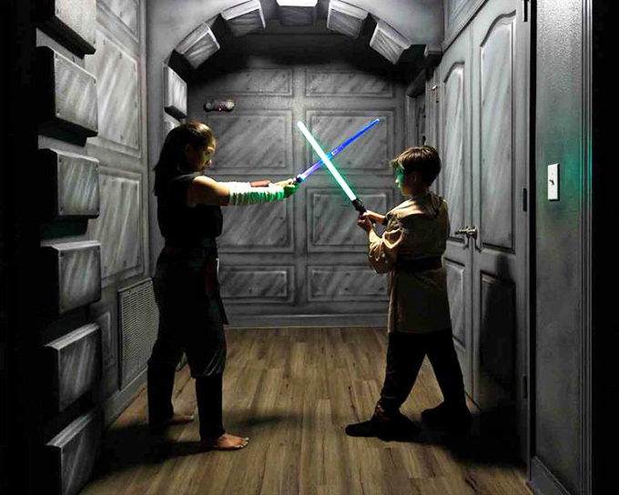 The hallway transforms into a stage for legendary lightsaber duels where family rivalries are settled with glowing blades and dramatic poses.