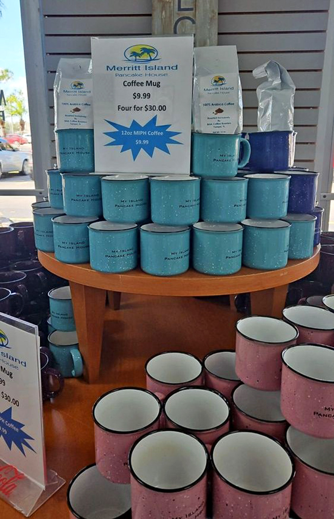 Colorful coffee mugs stand at attention like delicious ceramic soldiers, ready to be filled with liquid motivation for your day ahead.