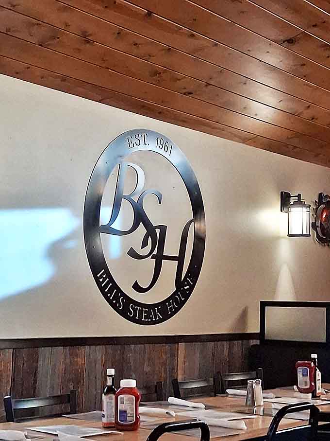 Sign decor: Established 1961&mdash;six decades of perfecting the art of steak. That metal logo gleams with the pride of tradition.