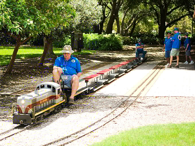 Volunteer engineers in their signature blue shirts prepare for another journey &ndash; their enthusiasm as powerful as their locomotives.