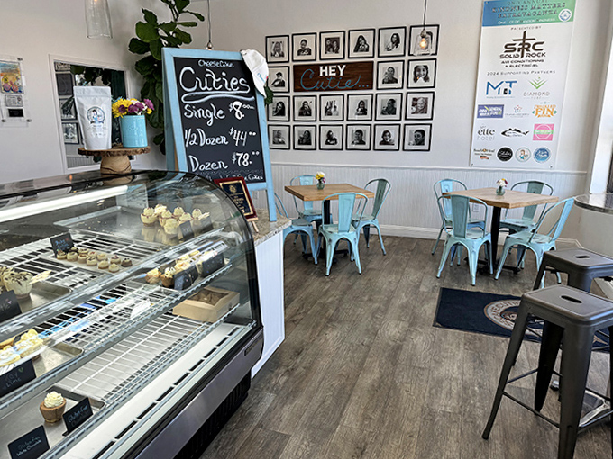 Cozy caf&eacute; seating with mint-colored metal chairs and wooden tables creates an inviting space to linger over treats.