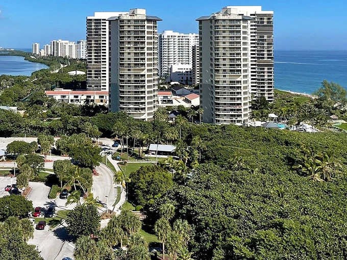Towering elegance meets beachfront bliss. These twin sentinels of luxury stand guard over a paradise where palm trees bow to ocean breezes.