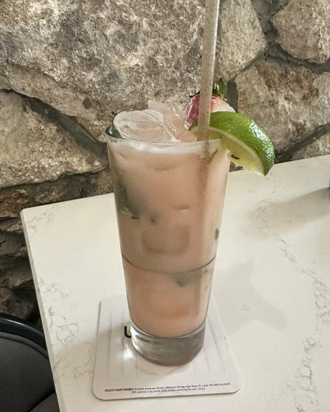 This Coconut Strawberry Mojito combines fresh mint, lime, and strawberry with coconut rum &ndash; the kind of drink that makes you want to extend your Florida vacation indefinitely.