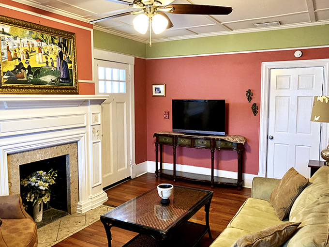 Cozy Living Room: Gather around the fireplace where modern comfort meets historic charm &ndash; just don't be surprised if the chair across from you indents slightly.