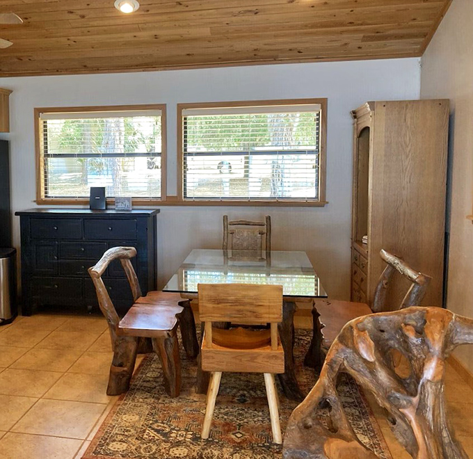 Dining with driftwood charm &ndash; where conversations flow as naturally as the lake waters visible through nearby windows.