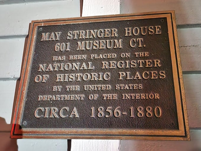 The official historic marker confirms the May-Stringer House's significance, recognized nationally for its architectural and historical importance.