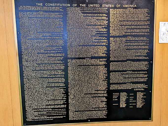 This detailed plaque of the Constitution serves as both decoration and inspiration, its golden text gleaming against a backdrop of timeless principles.