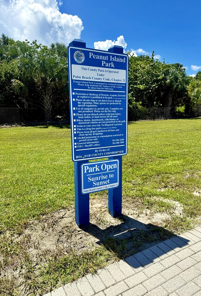 The official park sign outlines sunrise-to-sunset hours, though time seems to follow different rules when you're surrounded by such natural beauty.