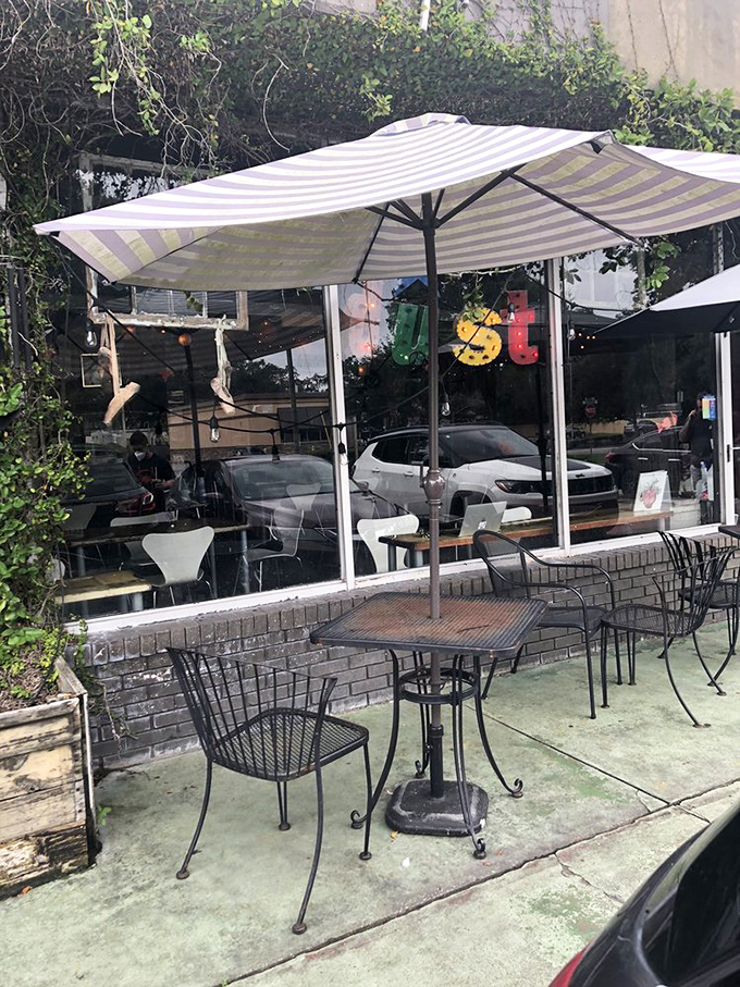The outdoor seating area offers urban tranquility under striped umbrellas &ndash; perfect for people-watching while sipping something wonderful.