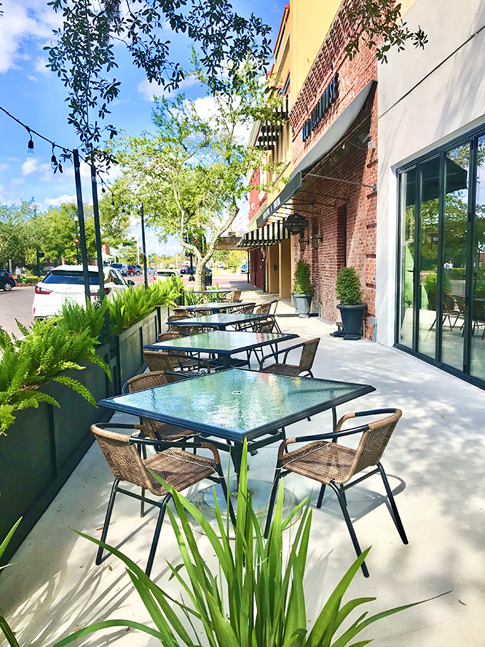 The outdoor patio offers a taste of freedom with your meal &ndash; fresh air, dappled sunlight, and the perfect vantage point for people-watching between bites.