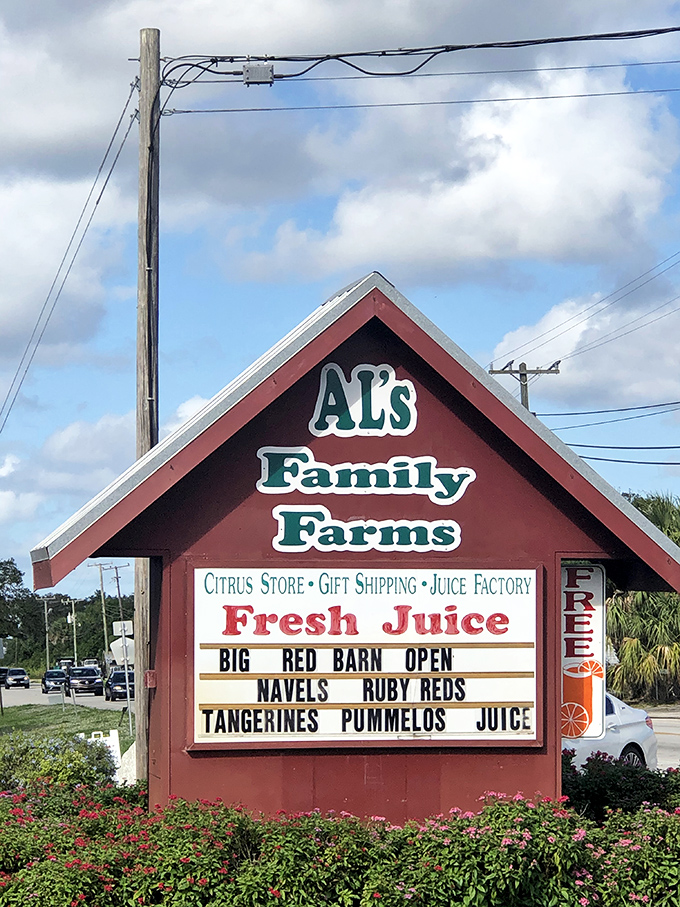 The roadside sign announces Al's Family Farms with the enthusiasm of someone who knows they've got something worth stopping for.