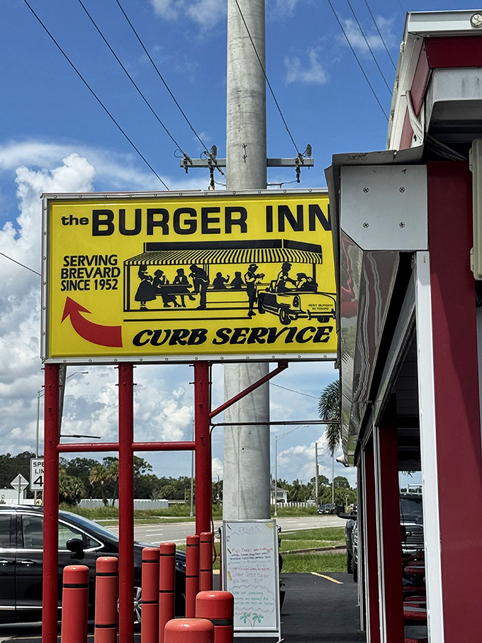 That yellow sign isn't just advertising &ndash; it's a promise kept for decades, beckoning burger lovers with its retro charm and bold lettering.