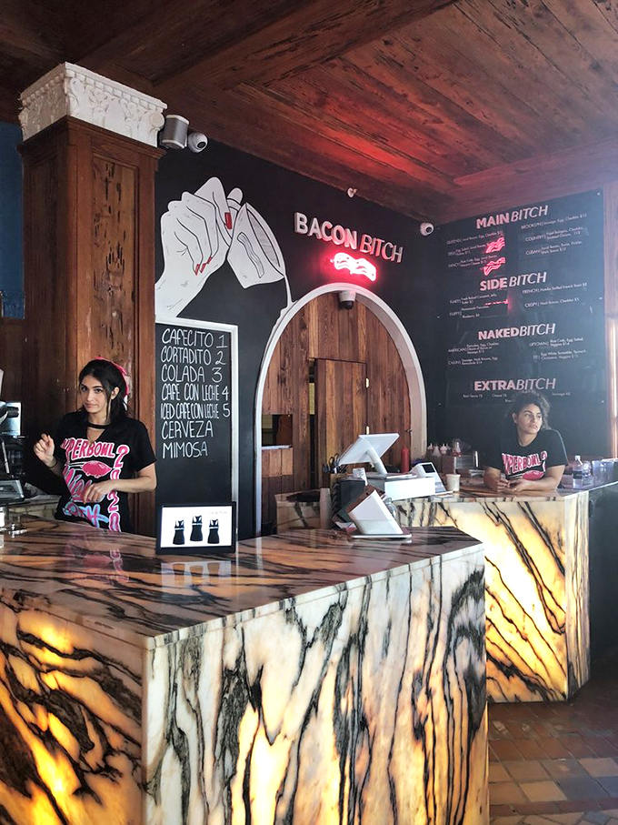The staff embodies the restaurant's sassy-but-professional vibe, ready to guide you through the bacon-centric menu options.