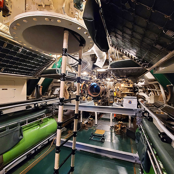 Red-lit sleeping quarters preserved exactly as they were during wartime &ndash; where submariners caught precious hours of rest between watches.