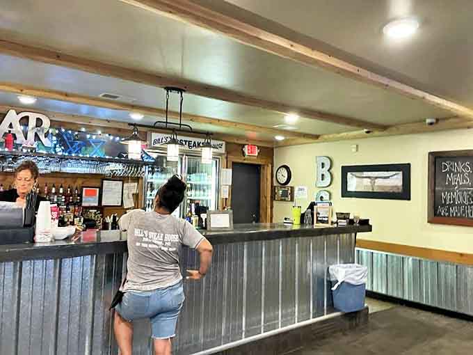 Bar: Where stories flow as freely as the drinks. That corrugated metal bar front adds just the right touch of rustic charm.