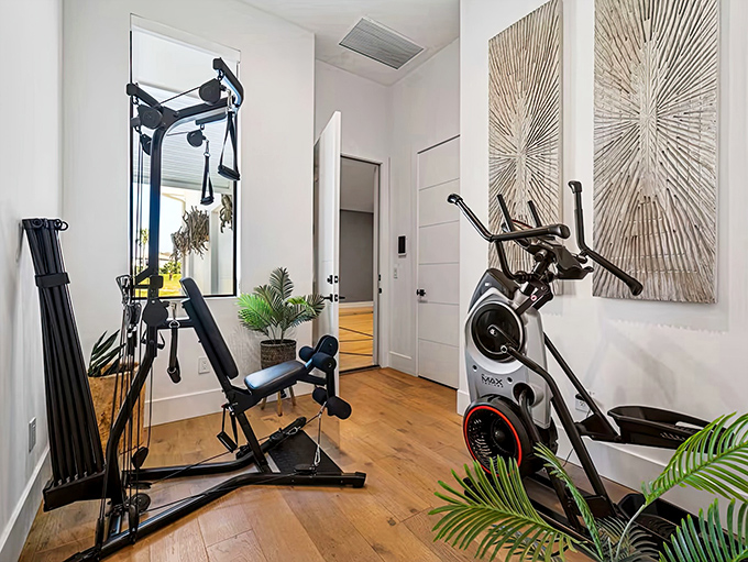 Fitness meets Florida sunshine in this well-equipped home gym where large windows ensure workouts come with vitamin D included.