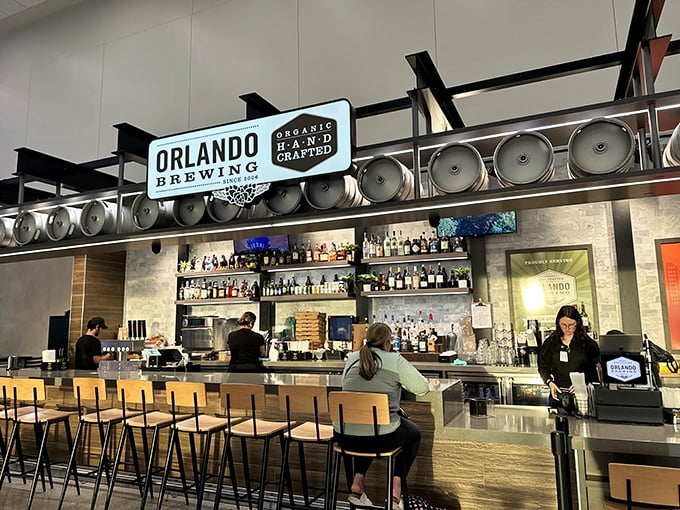 The sleek bar at Orlando Brewing's airport location provides a taste of local craft culture for visitors and locals alike.