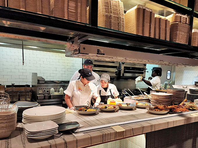 The open kitchen isn't just functional &ndash; it's theater. Those chefs aren't just cooking; they're conducting a symphony of sizzles, steam, and spectacular plating.