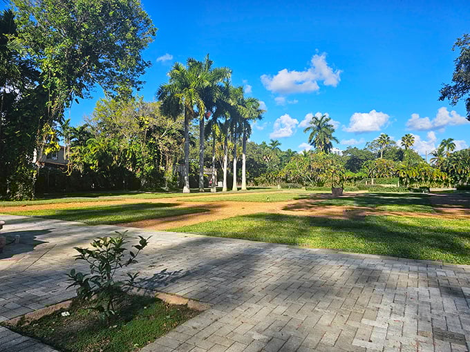 The monastery's open grounds invite exploration, with royal palm trees standing like exclamation points against Florida's brilliant blue sky.