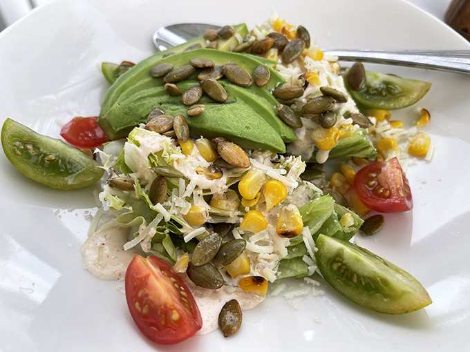 A salad that actually deserves to be photographed. Those pepitas and avocado slices are nature's way of high-fiving your good decisions.