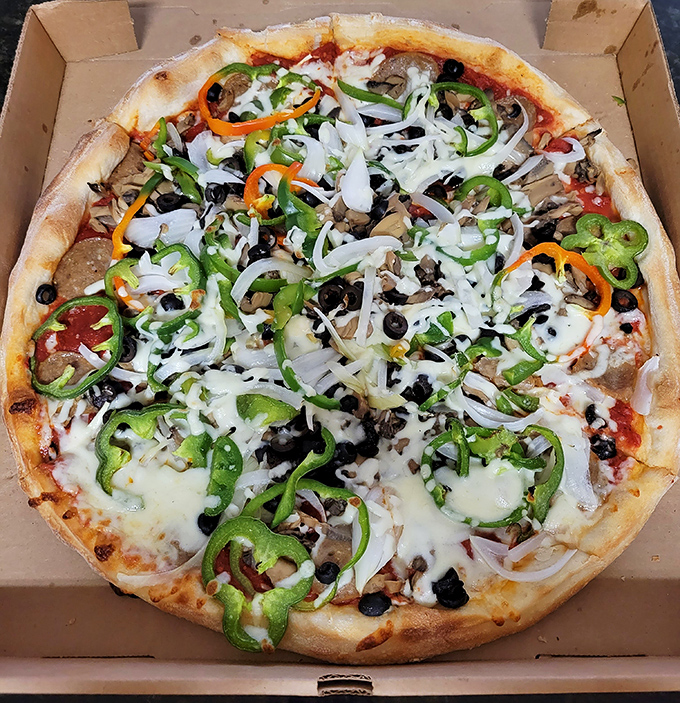 A colorful masterpiece where sweet bell peppers, savory sausage and caramelized onions create a flavor carnival on perfectly baked dough.