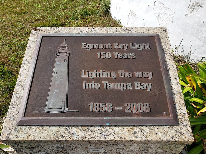 A commemorative plaque honors the lighthouse's 150 years of service, guiding countless vessels safely through Tampa Bay's waters.