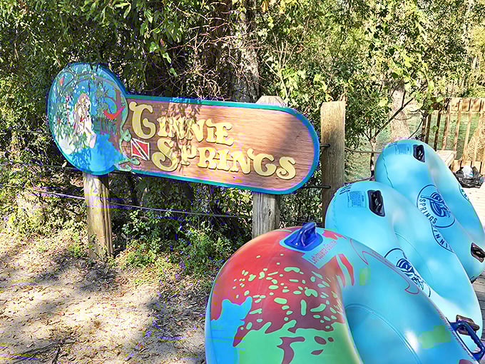 The iconic Ginnie Springs sign welcomes adventure-seekers with colorful promise of the aquatic wonderland beyond.