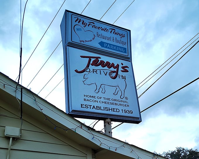 The iconic sign glows against the Florida sky, a beacon that's guided hungry travelers and loyal locals to burger nirvana for generations.