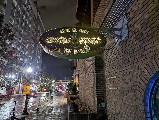 The exterior sign glows ominously against Orlando's night sky, beckoning visitors to step into a world where Halloween never ends.